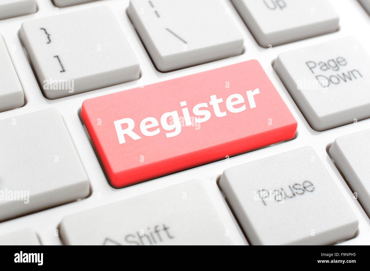 Red register key on keyboard Stock Photo - Alamy