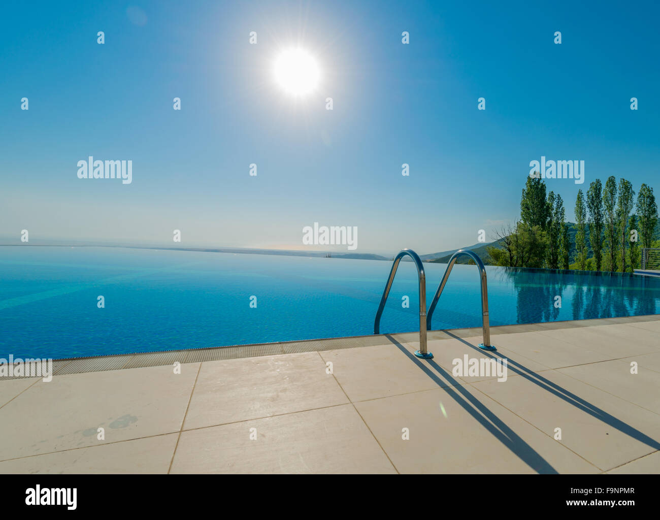 Infinity pool on the bright summer day Stock Photo - Alamy