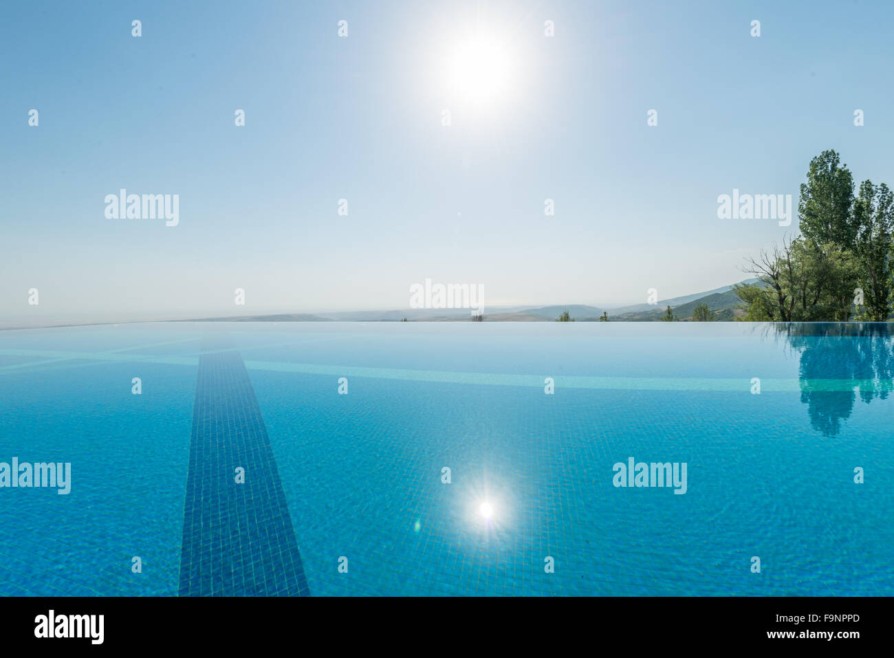 Infinity pool on the bright summer day Stock Photo - Alamy