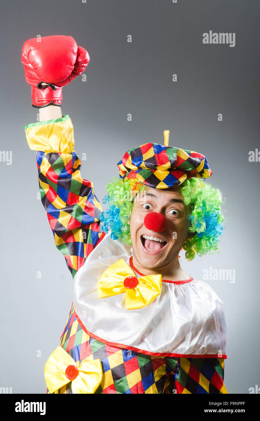 Clown with boxing gloves isolated on white Stock Photo - Alamy