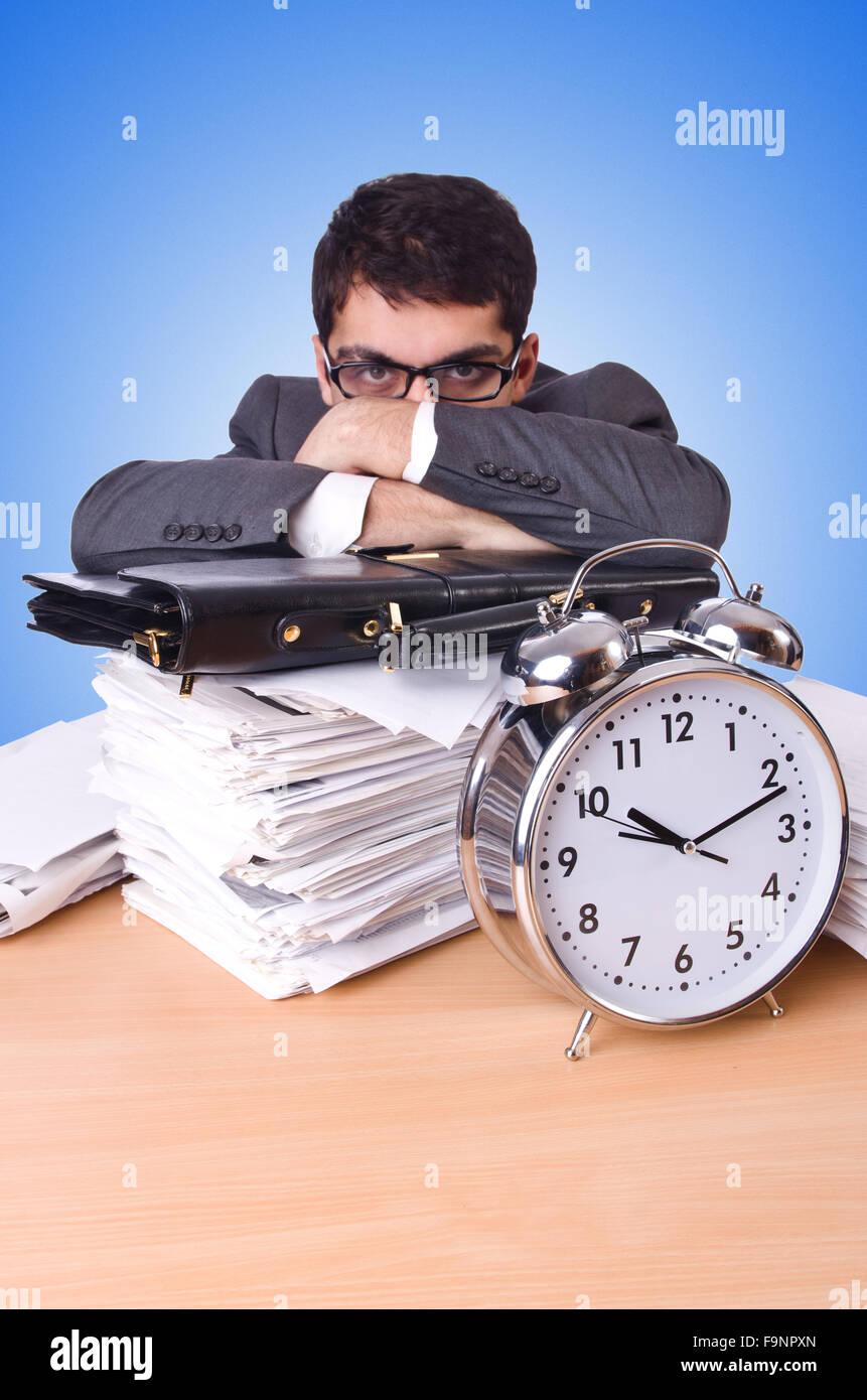 Woman businessman with giant alarm clock Stock Photo - Alamy