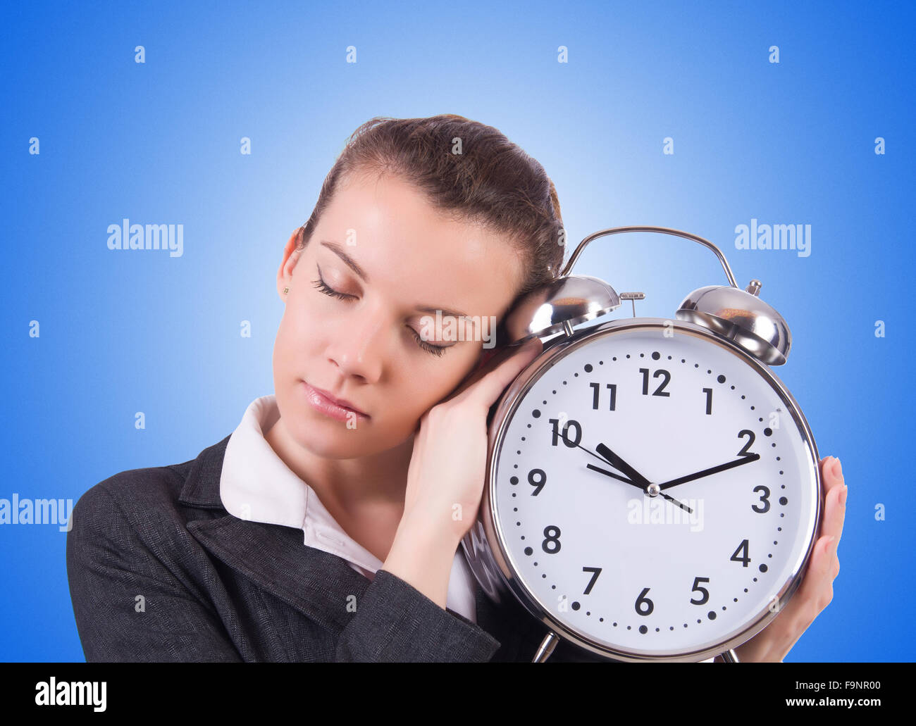 Woman with giant clock on white Stock Photo - Alamy