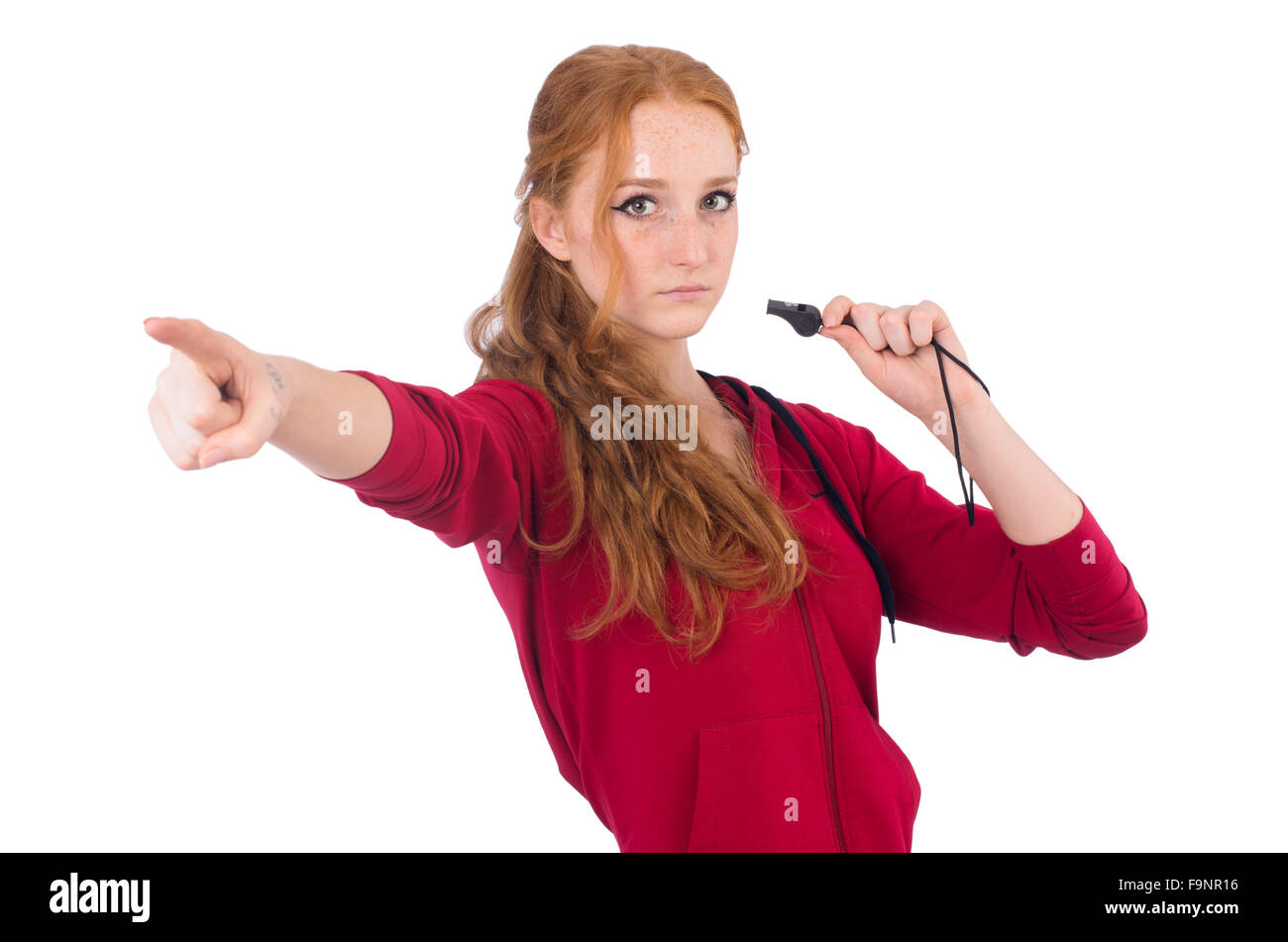 Pretty female sportsman holding whistle isolated on white Stock Photo ...