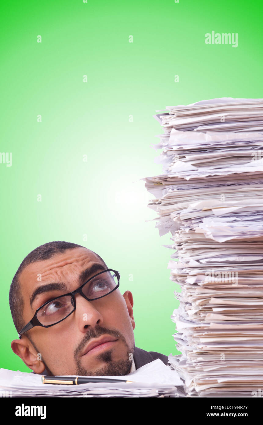 Busy businessman with lots of papers Stock Photo - Alamy