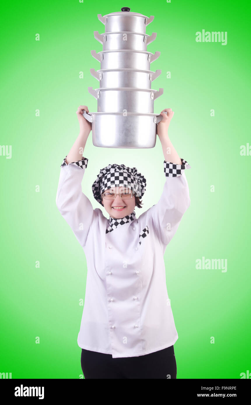 Cook with stack of pots on white Stock Photo - Alamy
