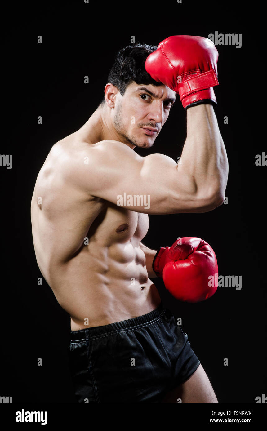 Muscular man in boxing concept Stock Photo - Alamy