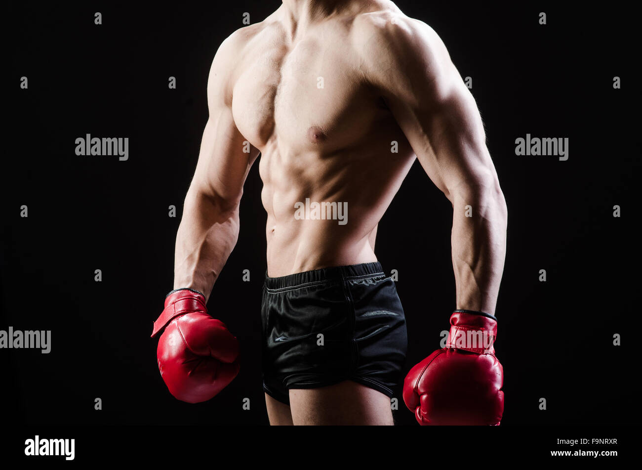 Muscular man in boxing concept Stock Photo - Alamy