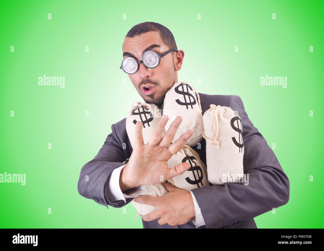 Man with money sacks on white Stock Photo - Alamy