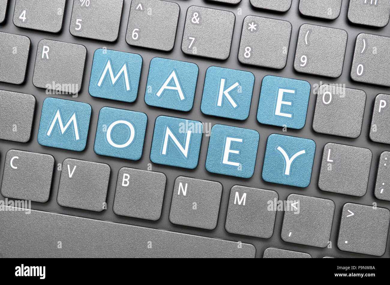 Blue make money key on keyboard Stock Photo - Alamy