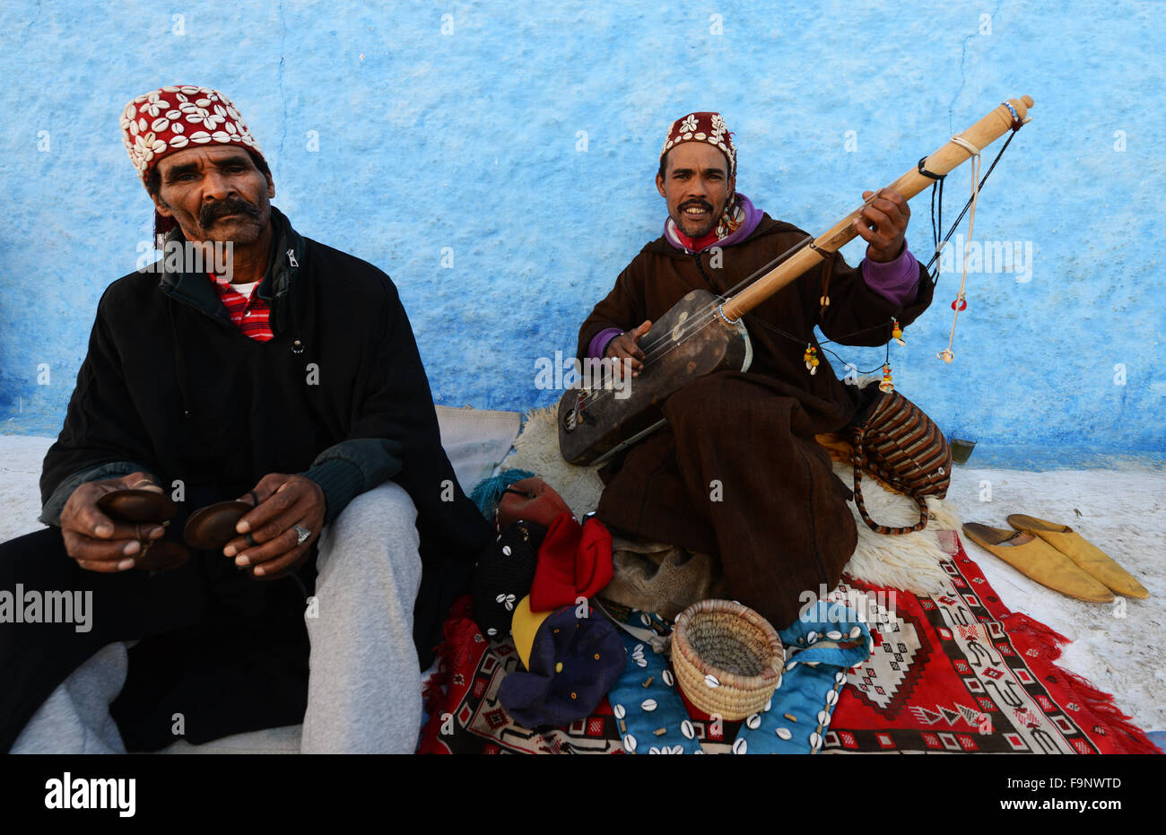 Gnawa musicians playing the Sintir and the Krakebs in the kasbah or ...