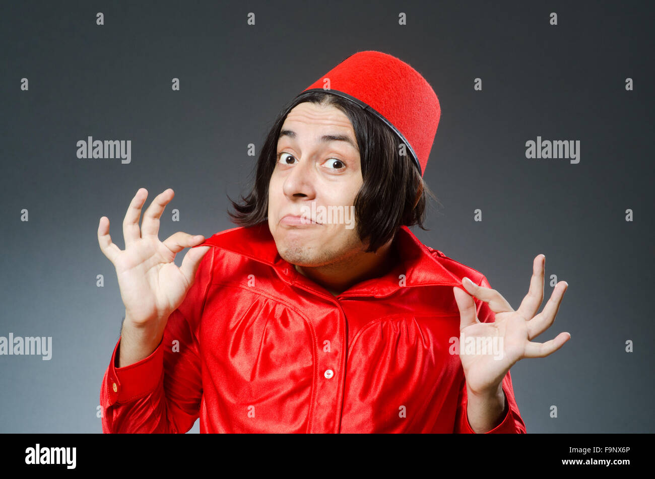 Man wearing red fez hat Stock Photo - Alamy