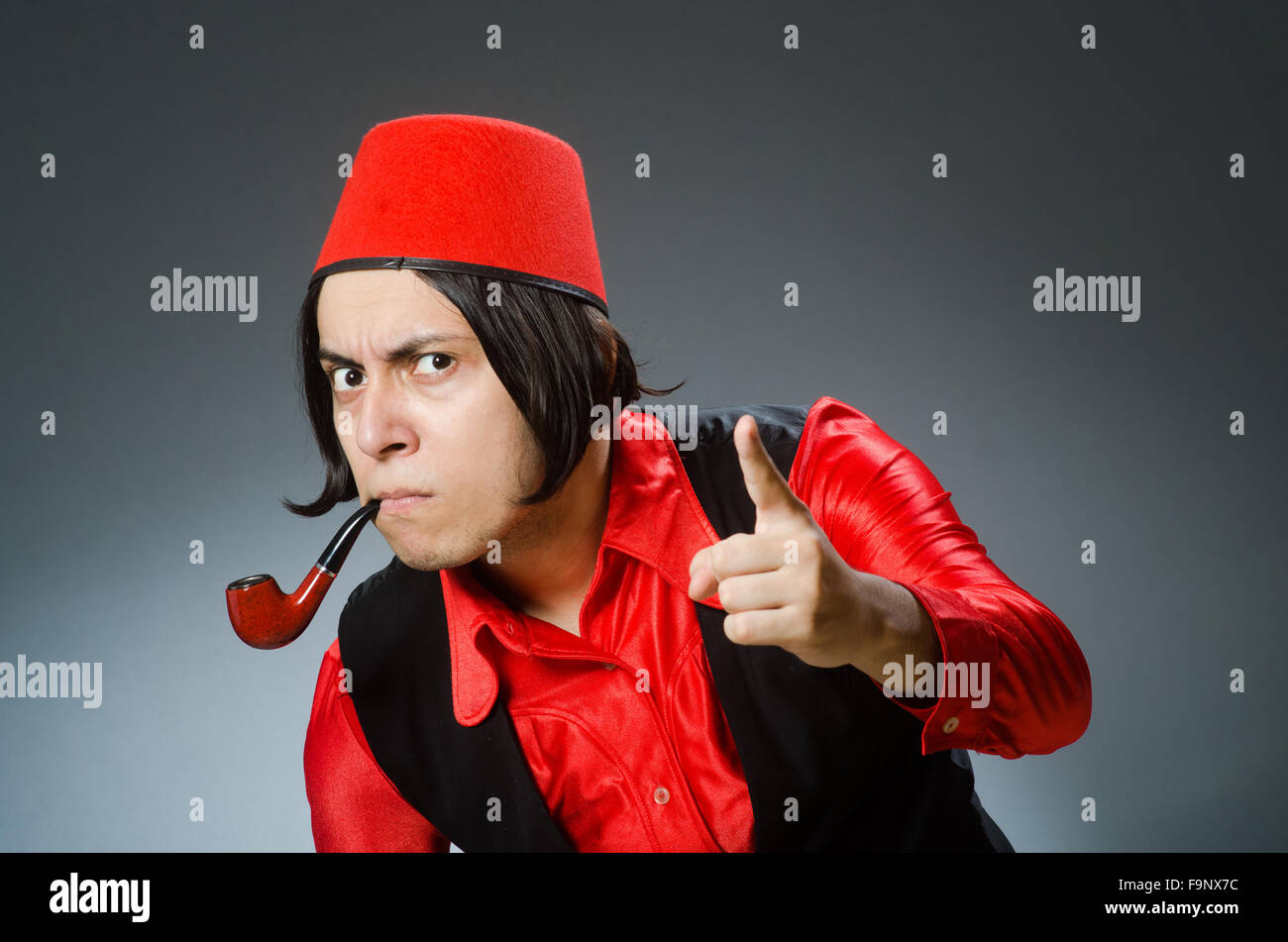 Man wearing red fez hat Stock Photo - Alamy