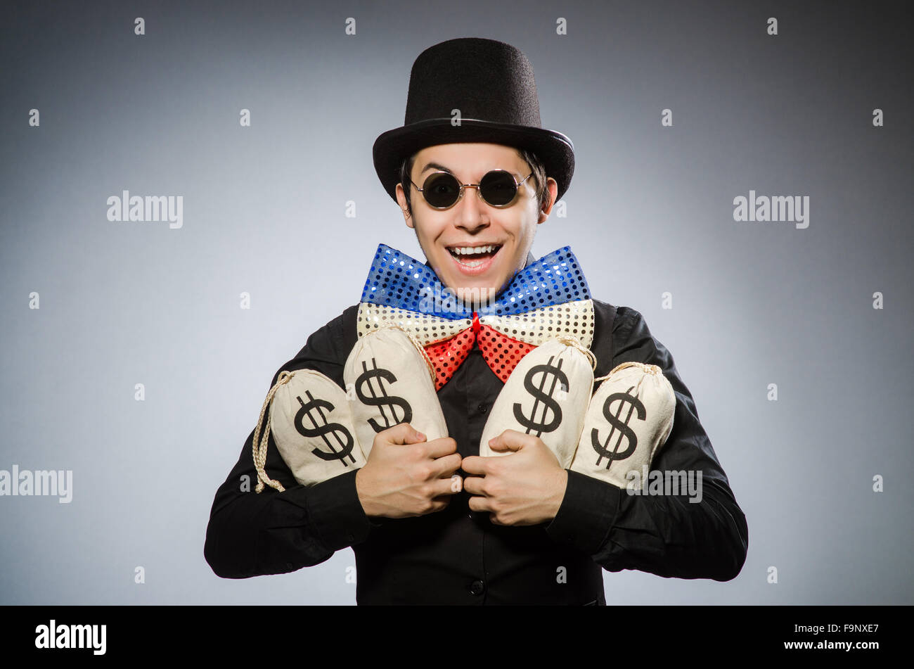 Funny man with money dollar sacks Stock Photo - Alamy