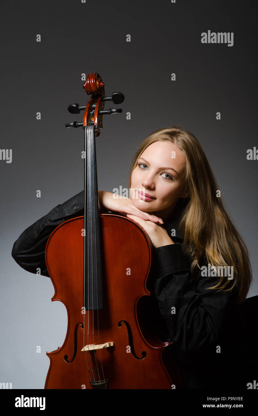 Woman playing classical cello in music concept Stock Photo - Alamy