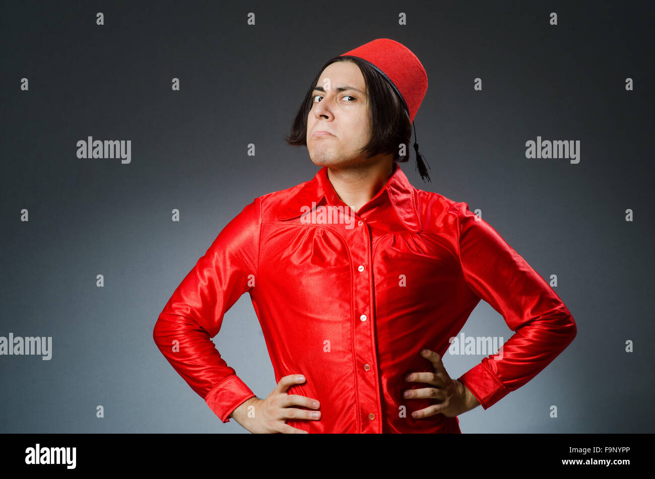 Man wearing red fez hat Stock Photo - Alamy