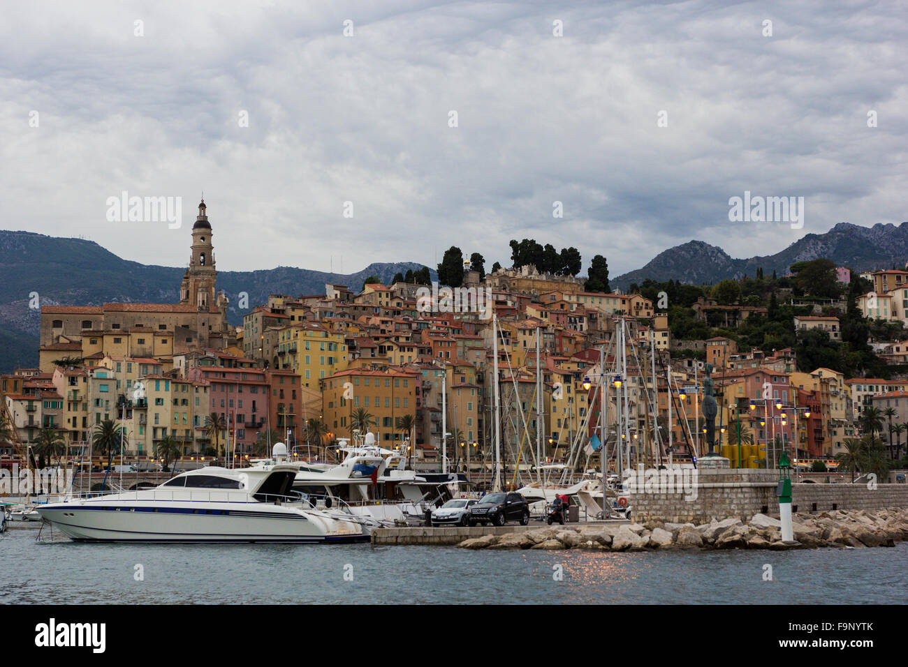 Harbor of Menton with the basilica of Saint-Michel-Archange in the ...