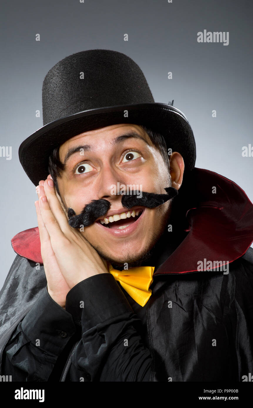 Funny magician man wearing tophat Stock Photo - Alamy