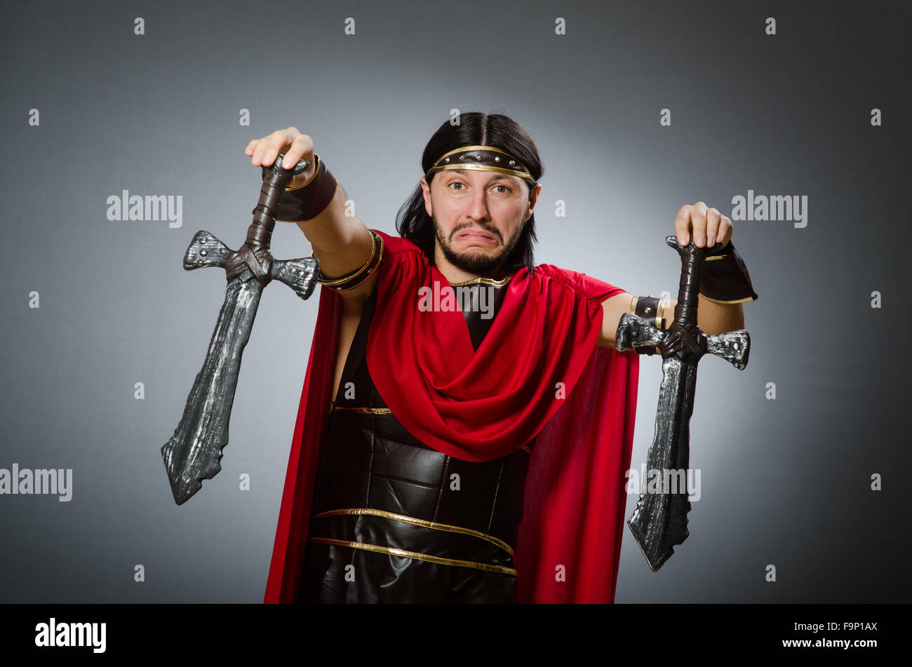 Roman warrior with sword against background Stock Photo - Alamy