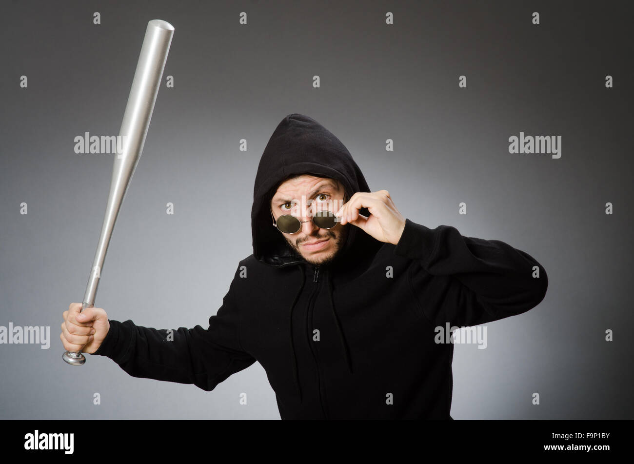Aggressive man with basebal bat Stock Photo - Alamy