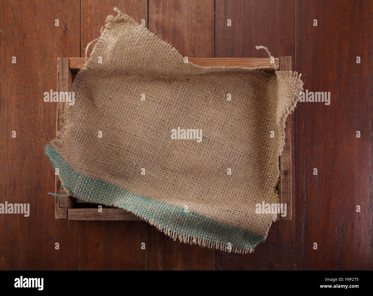 sack cloth on top of wooden crate Stock Photo - Alamy