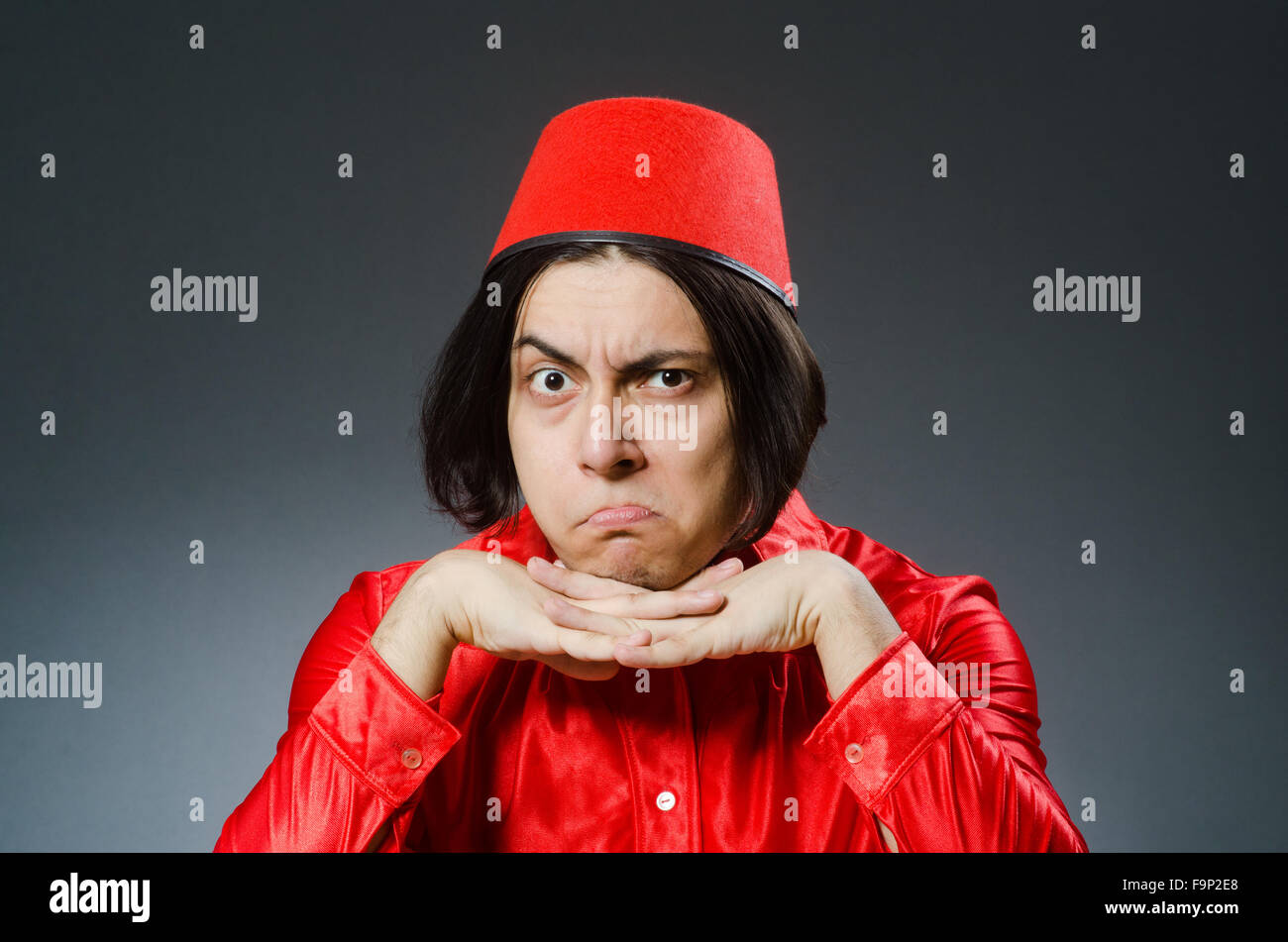 Man wearing red fez hat Stock Photo - Alamy