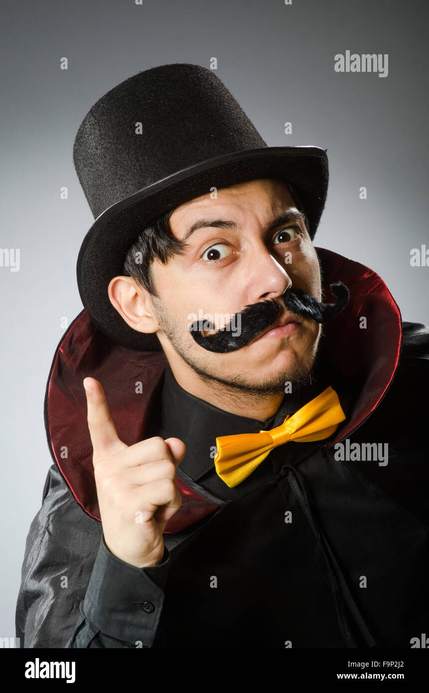 Funny magician man wearing tophat Stock Photo - Alamy