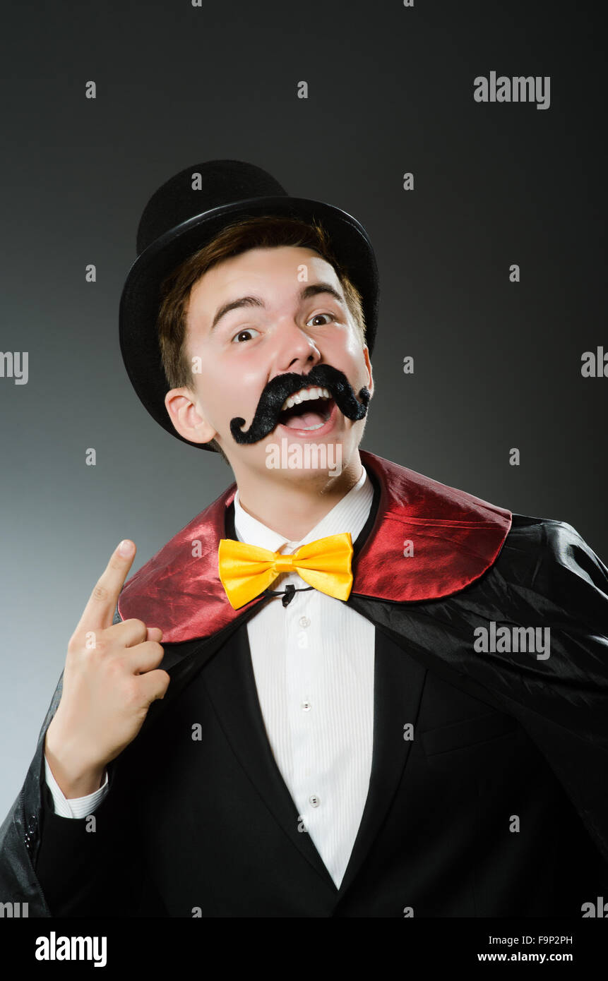 Funny magician man wearing tophat Stock Photo - Alamy