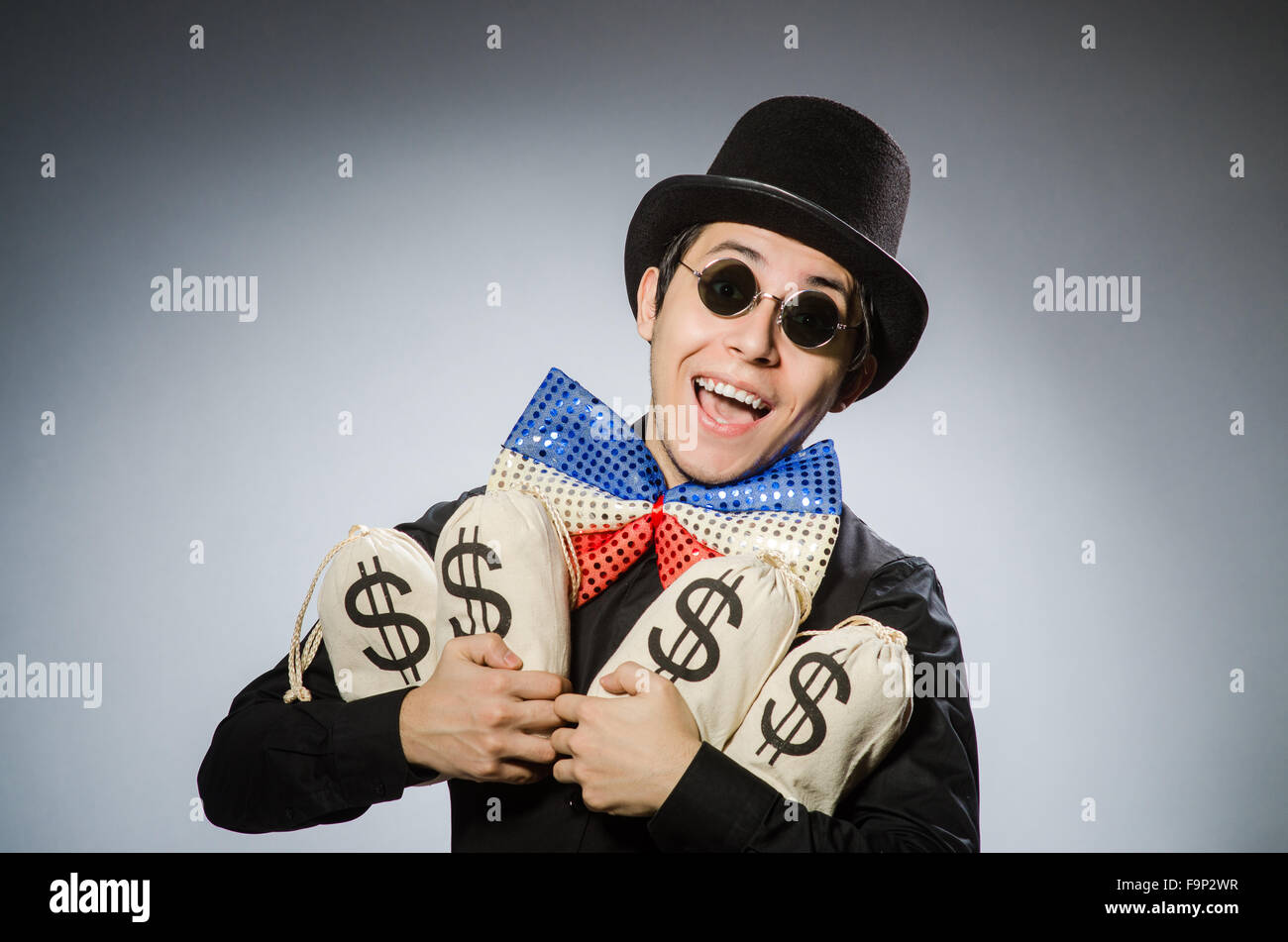 Funny man with money dollar sacks Stock Photo - Alamy