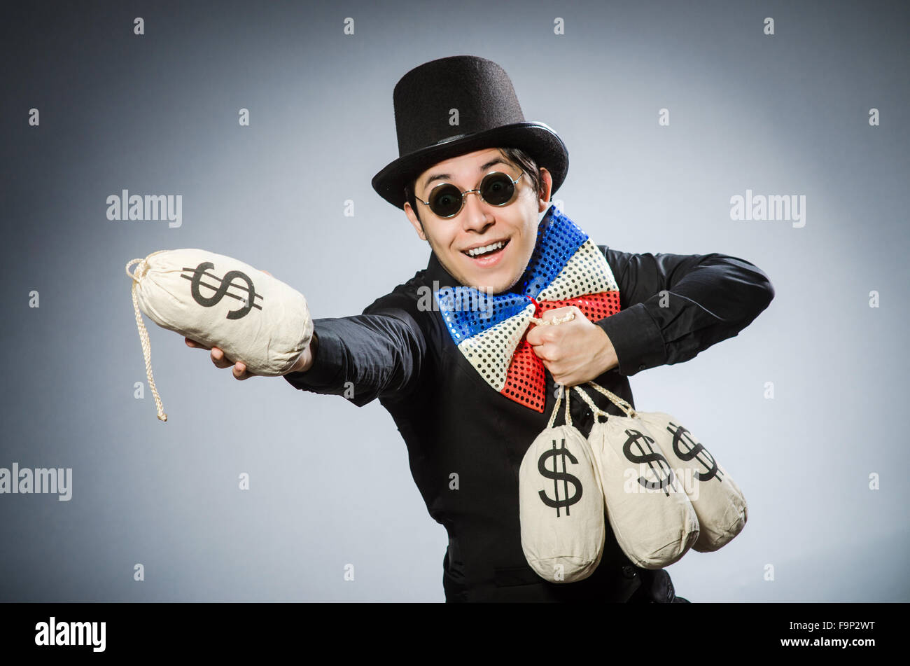 Funny man with money dollar sacks Stock Photo - Alamy