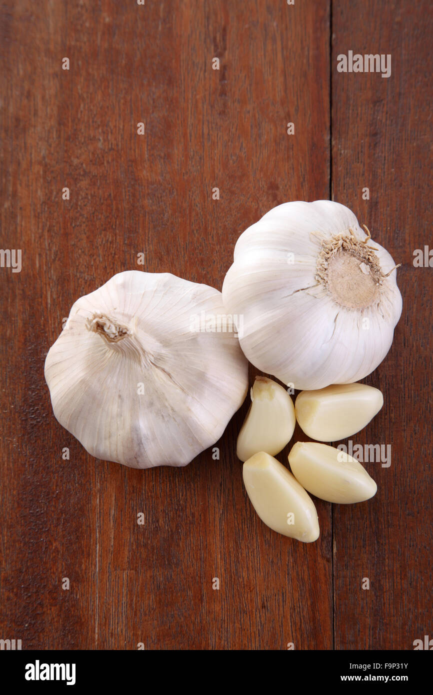 Organic garlic whole and cloves on the wooden background Stock Photo ...