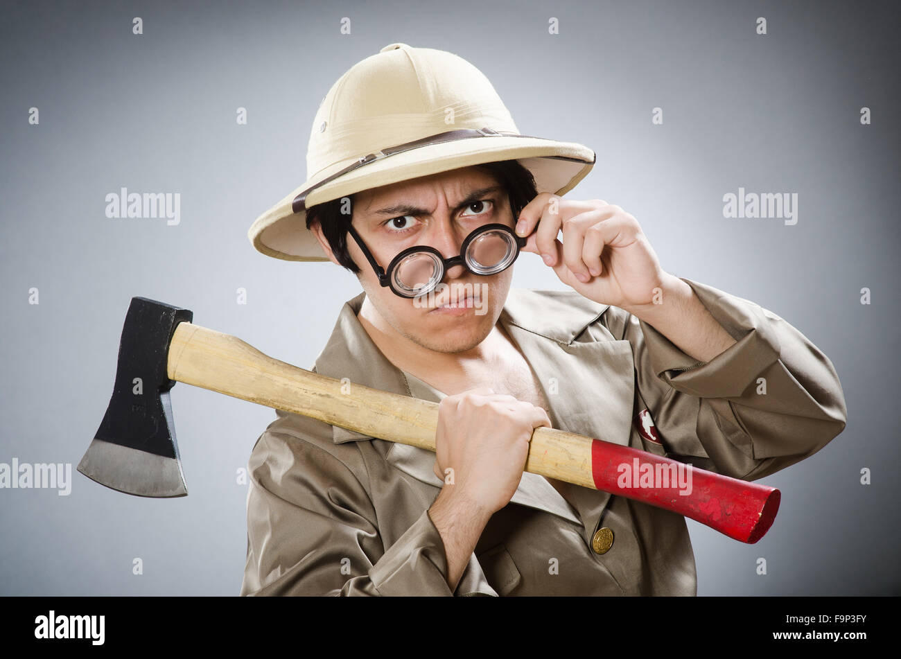 Funny safari traveller in travelling concept Stock Photo - Alamy