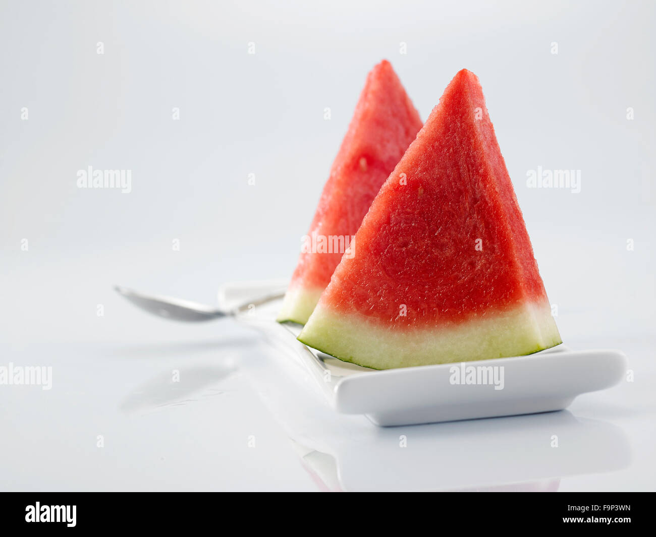 watermelon cut in to a triangle shape Stock Photo - Alamy