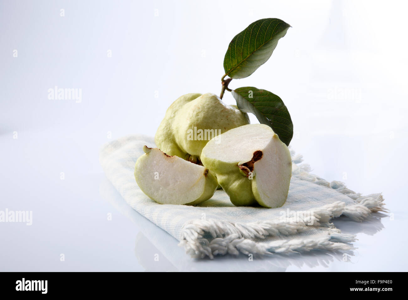 green quava with leaf on table cloth Stock Photo - Alamy