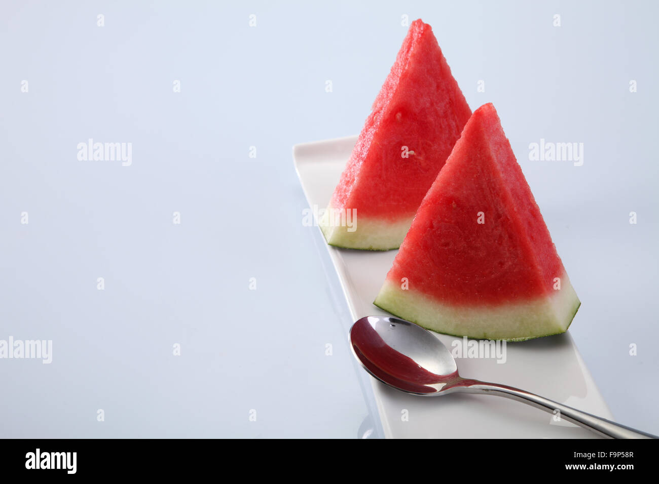 watermelon cut in to a triangle shape Stock Photo - Alamy