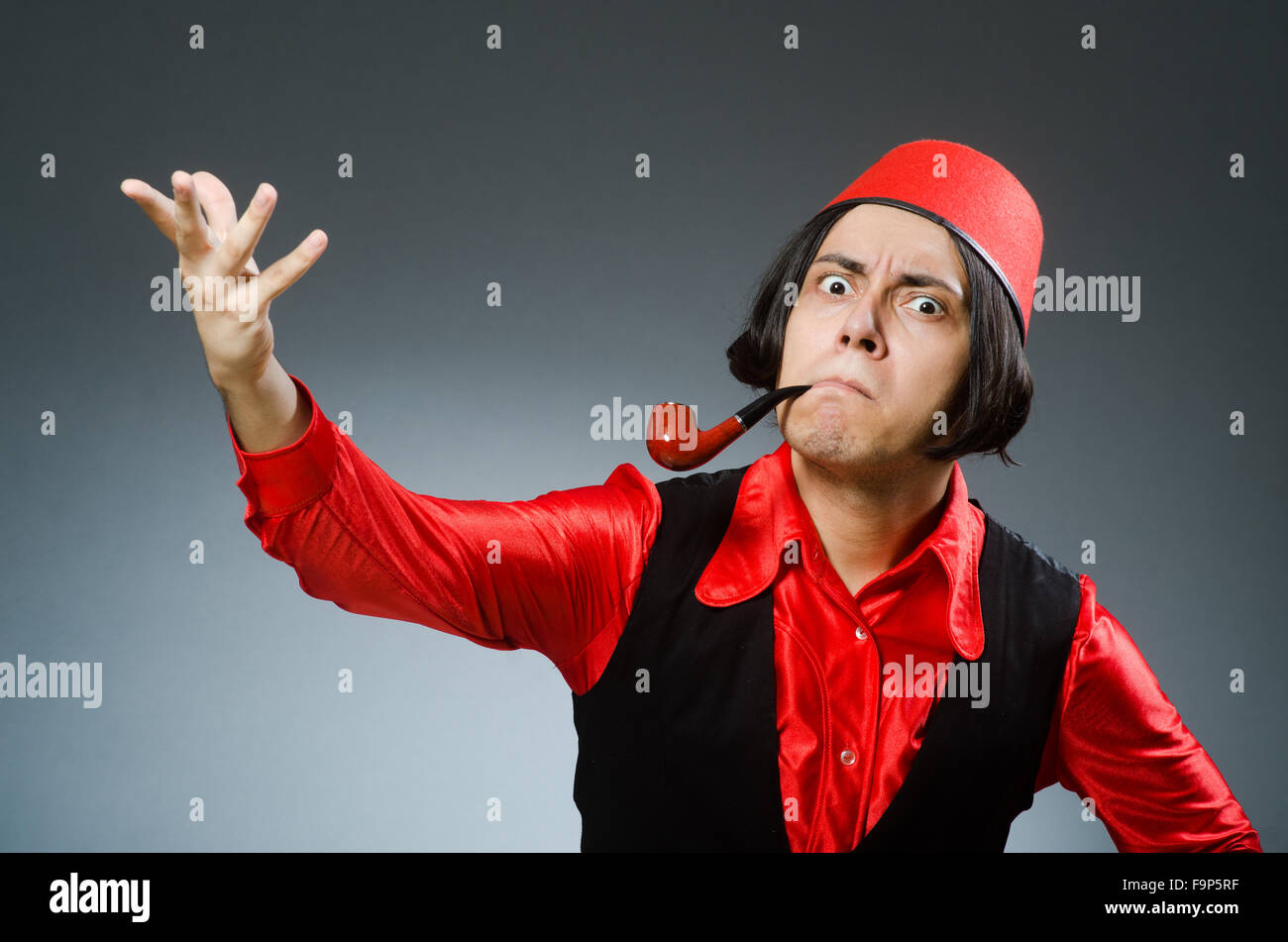 Man wearing red fez hat Stock Photo - Alamy
