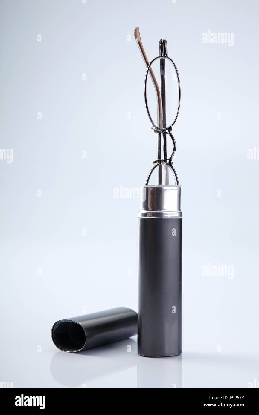 reading glass with gray container Stock Photo - Alamy