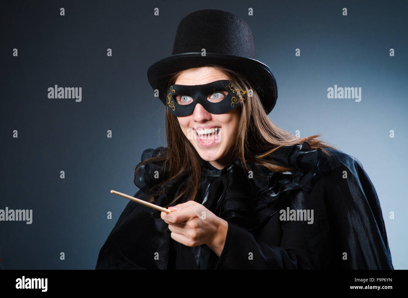 Woman magician in funny concept Stock Photo - Alamy