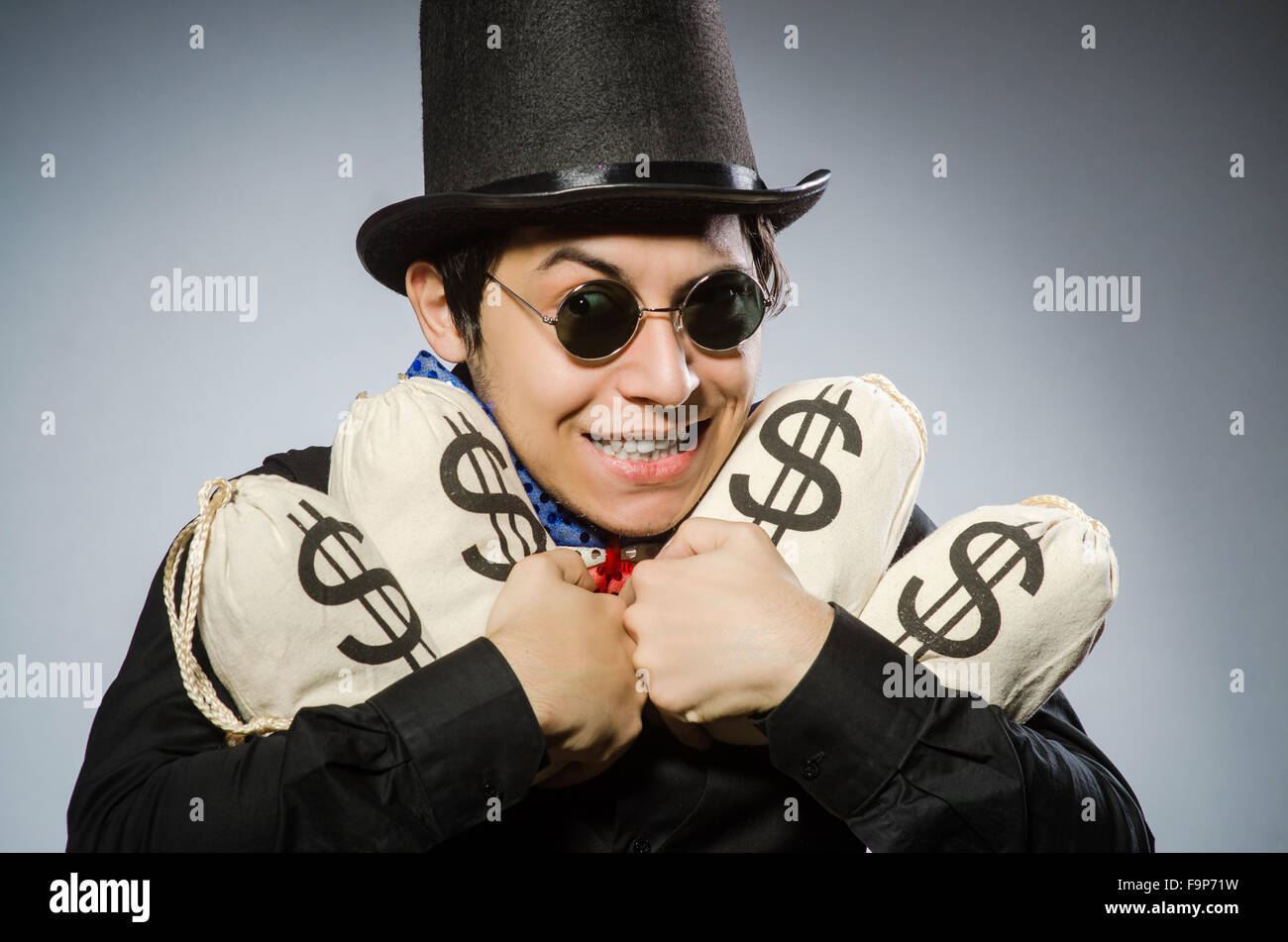 Funny man with money dollar sacks Stock Photo - Alamy