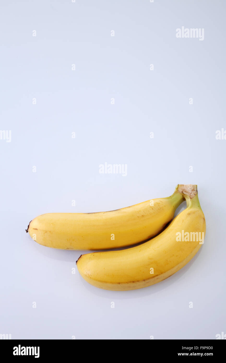 Two bananas isolated on white background Stock Photo - Alamy