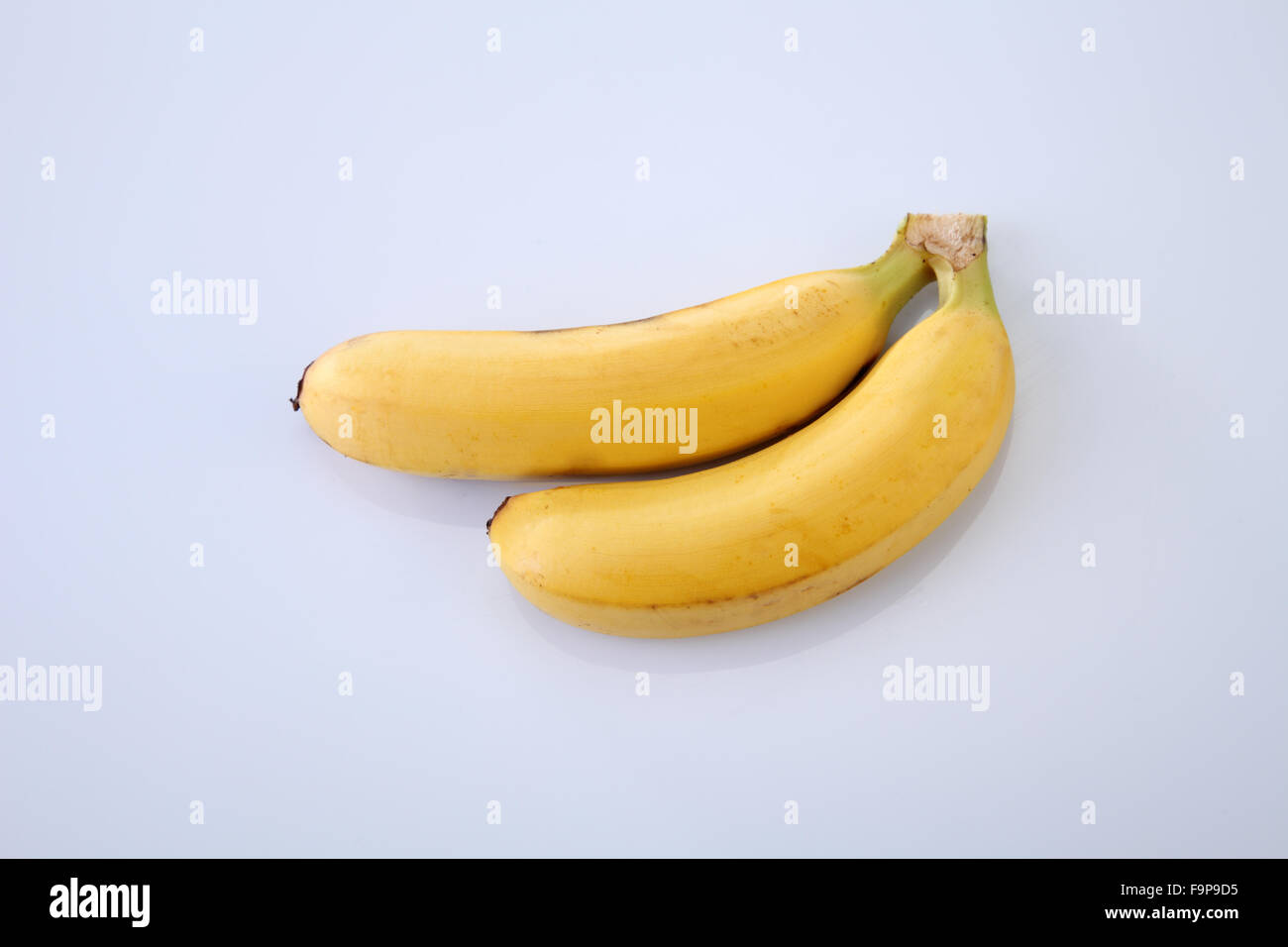 Two bananas isolated on white background Stock Photo - Alamy