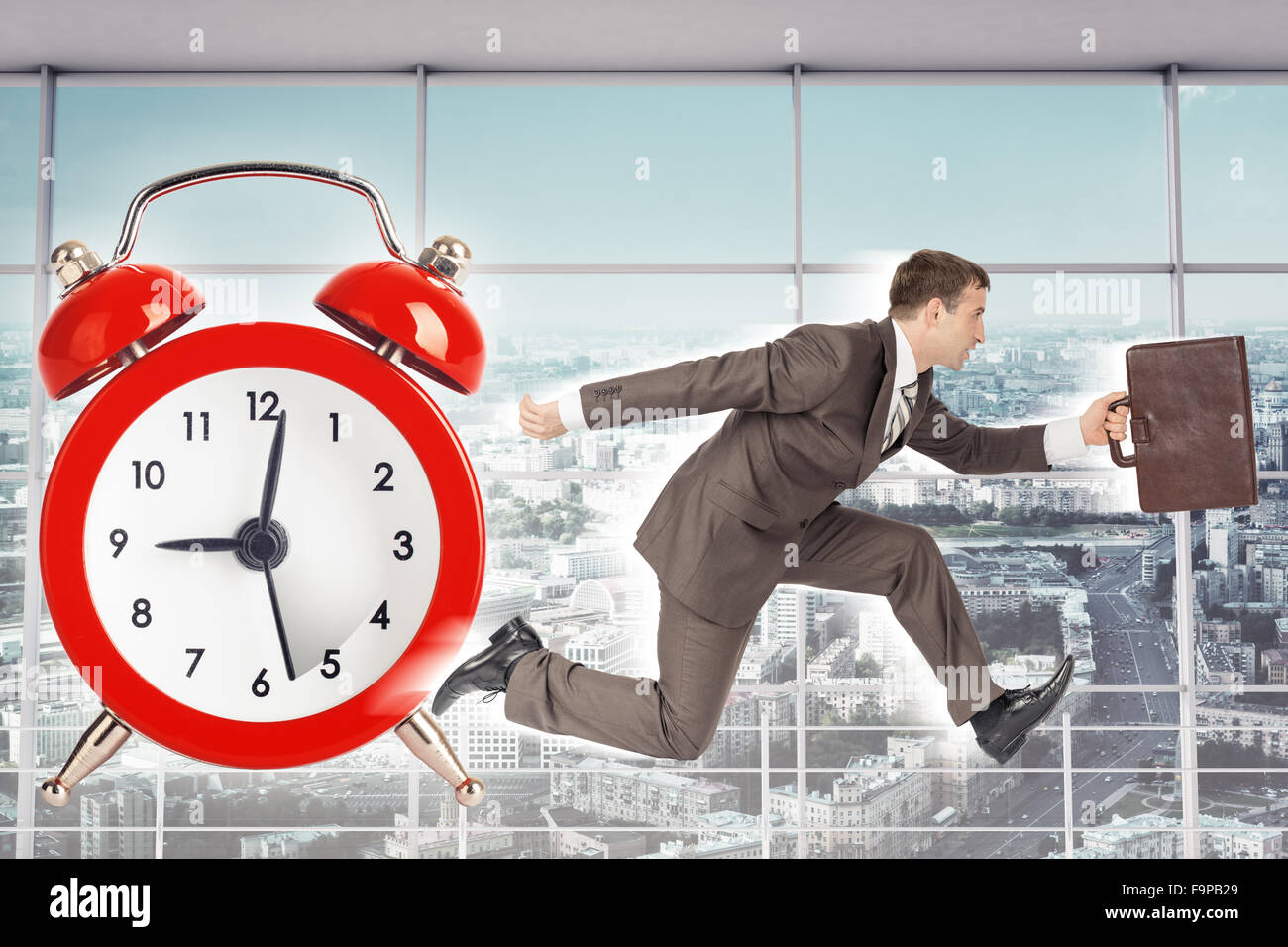 Businessman running with alarm clock background Stock Photo - Alamy