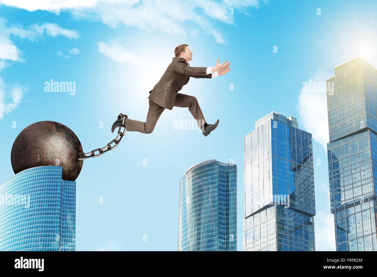 Young man jumping over gap Stock Photo - Alamy