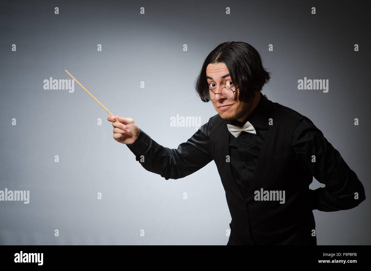 Funny conductor in musical concept Stock Photo - Alamy