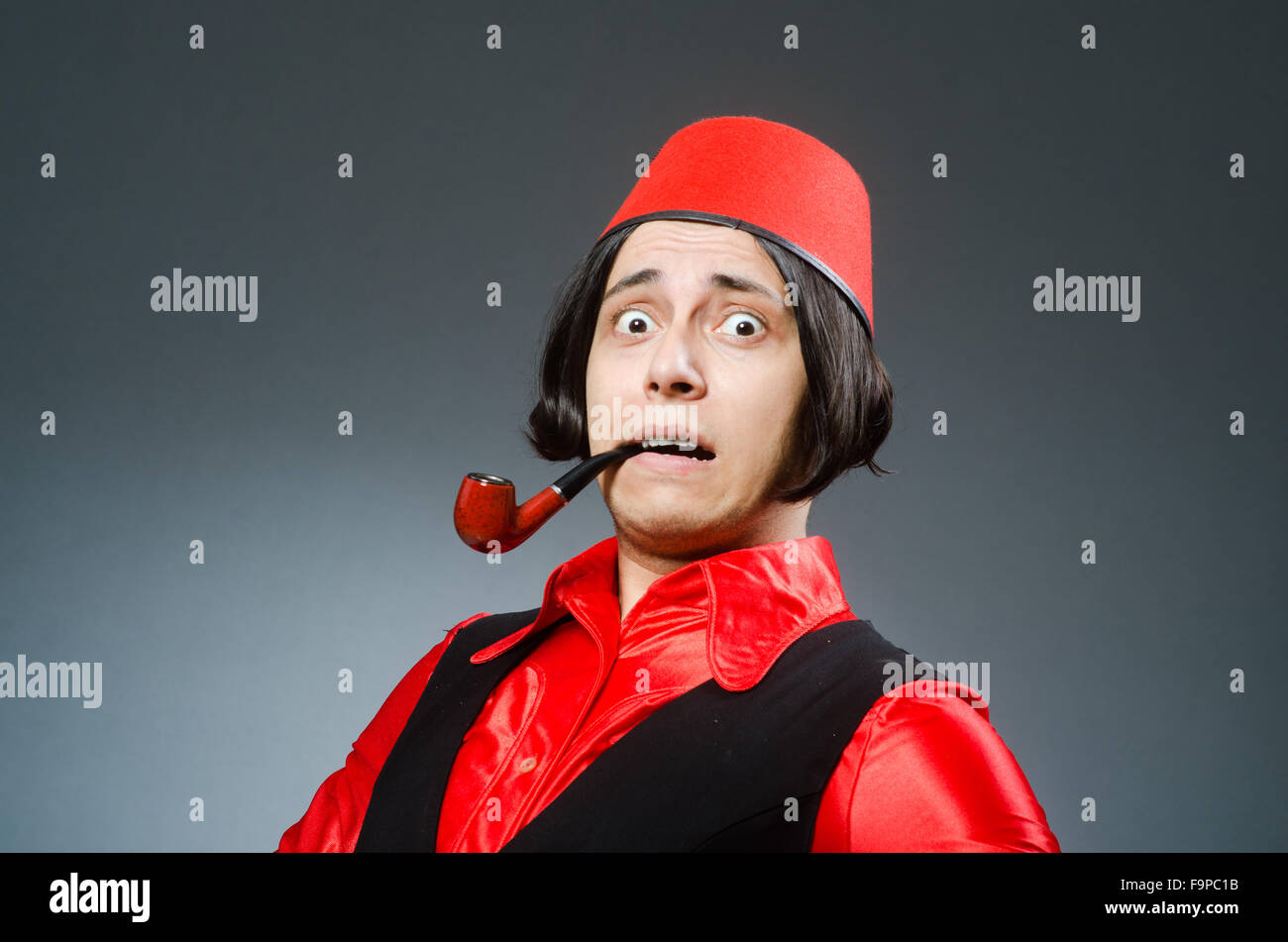 Man wearing red fez hat Stock Photo - Alamy