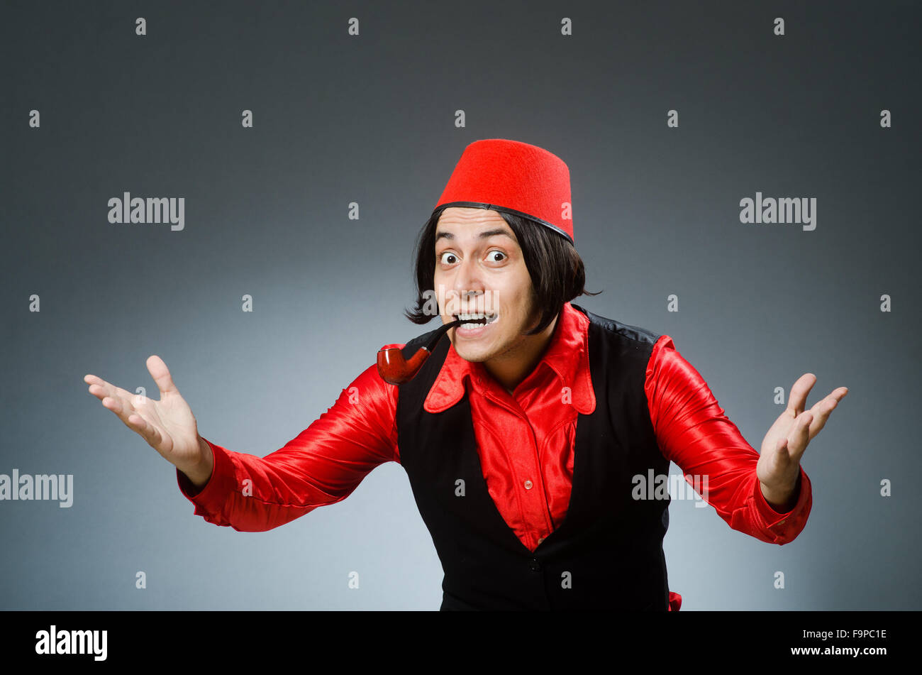 Man wearing red fez hat Stock Photo - Alamy