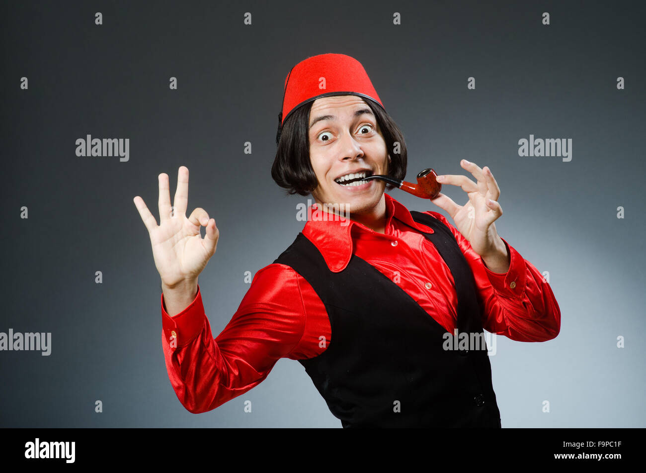 Man wearing fez hat smoking hi-res stock photography and images - Alamy