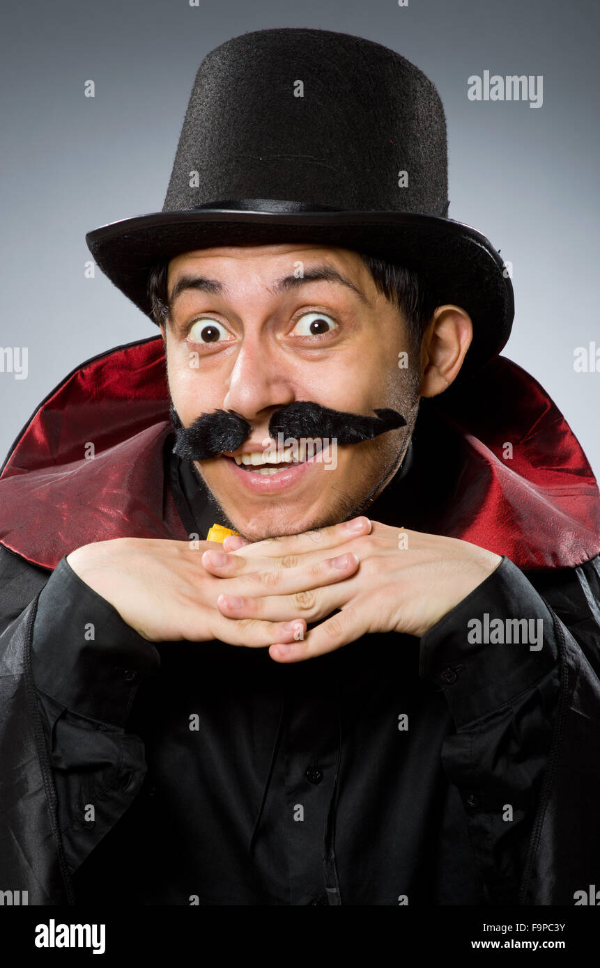 Funny magician man wearing tophat Stock Photo - Alamy