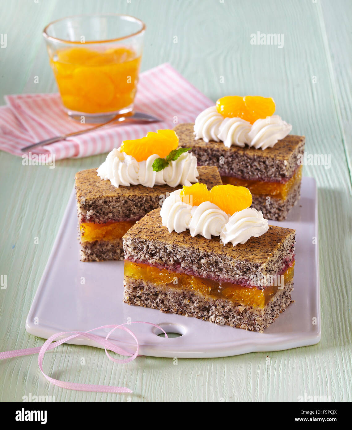 Mandarin orange and poppy seed slice Stock Photo - Alamy