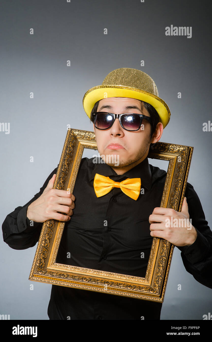Funny man with picture frame Stock Photo - Alamy