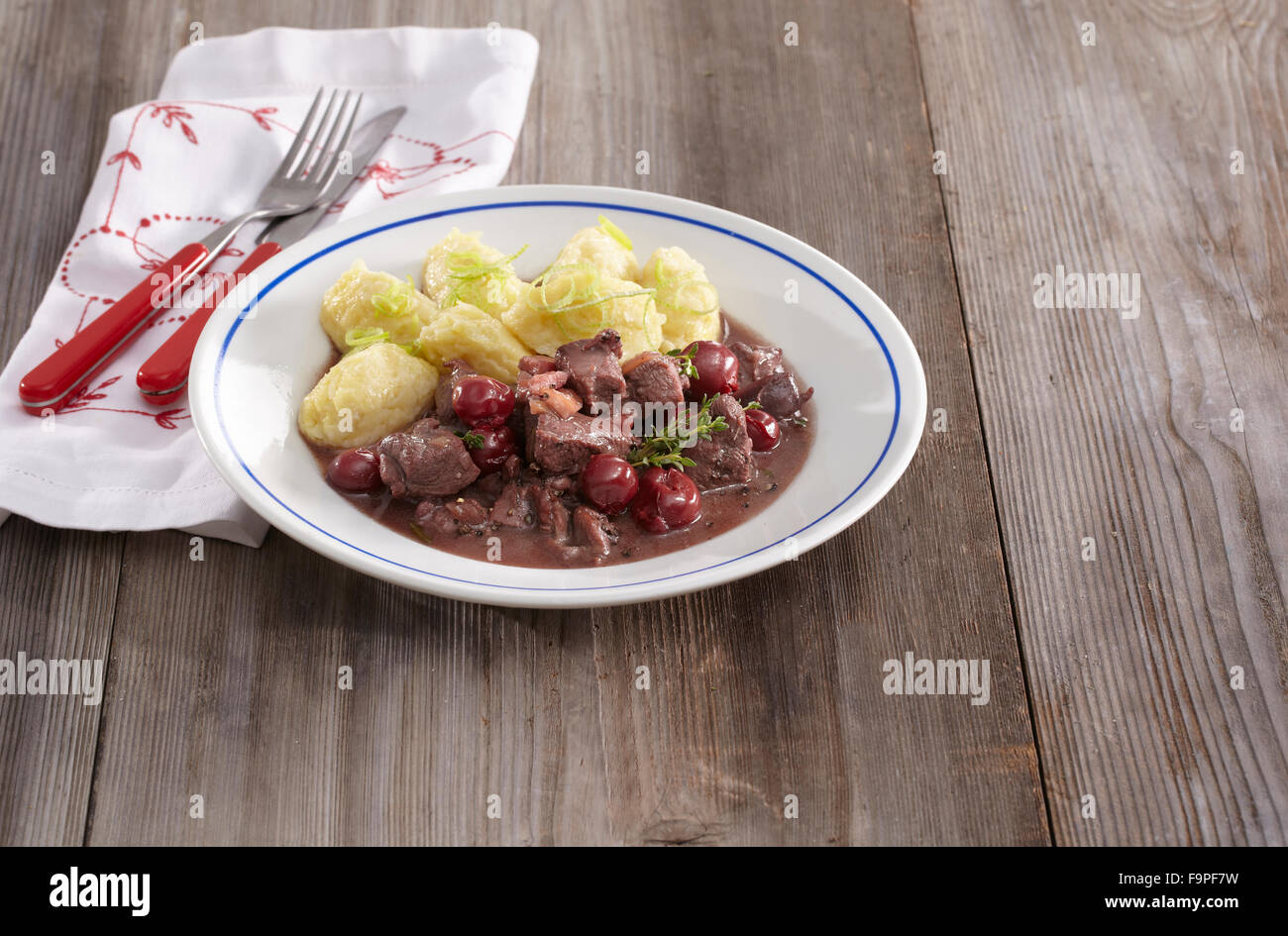 Duck and sour cherry stew Stock Photo - Alamy